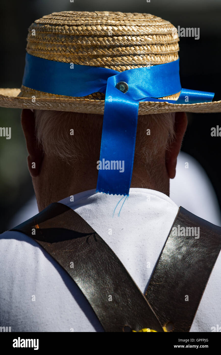 Traditional ribboned straw hat worn by cheese carriers in the market of ...