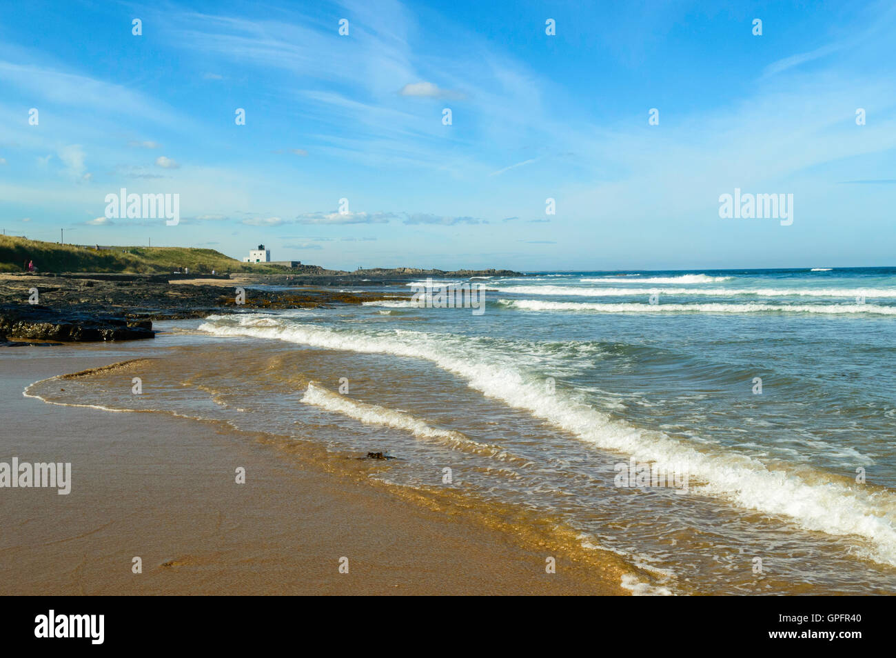 Bamburgh Beach on a sunny August Bank Holiday Monday Stock Photo - Alamy