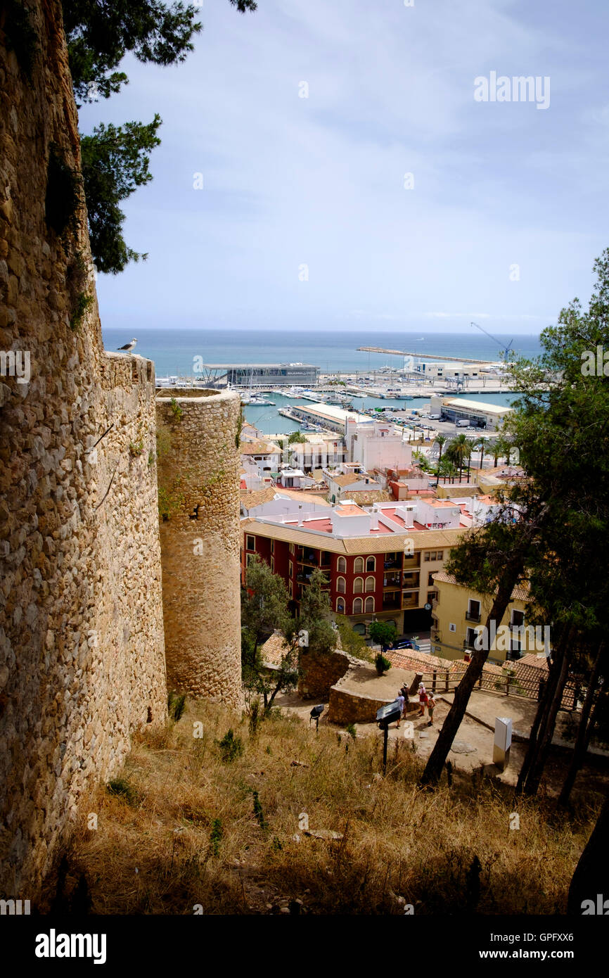 Denia commercial port and the walls of Denia Castle Stock Photo - Alamy