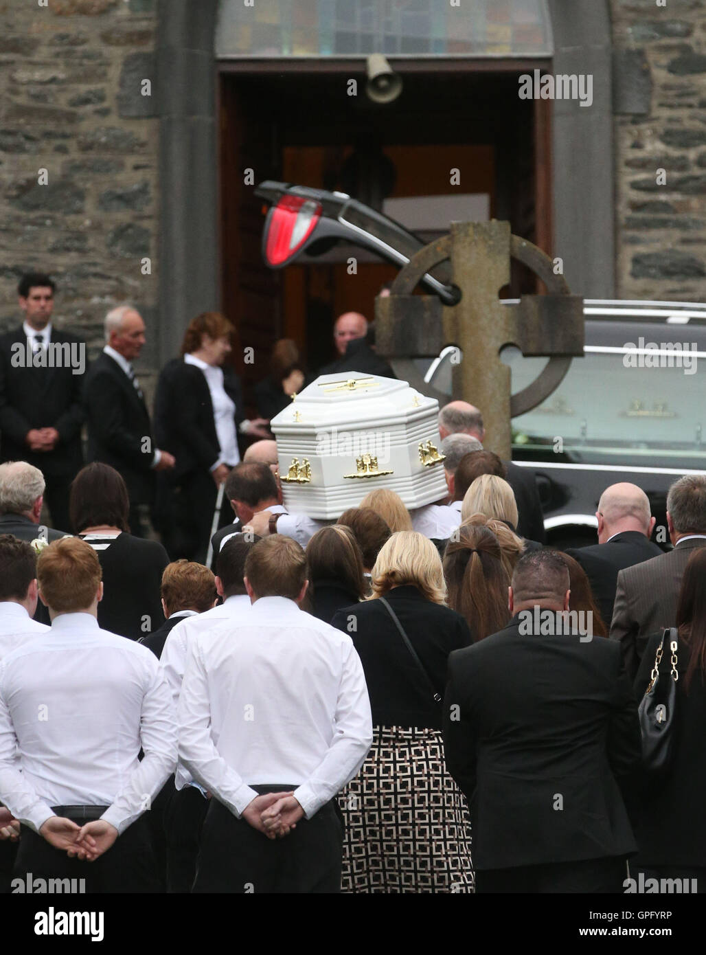 Coffins are taken into Saint Mary's Church in Castlerahan, Co Cavan ...
