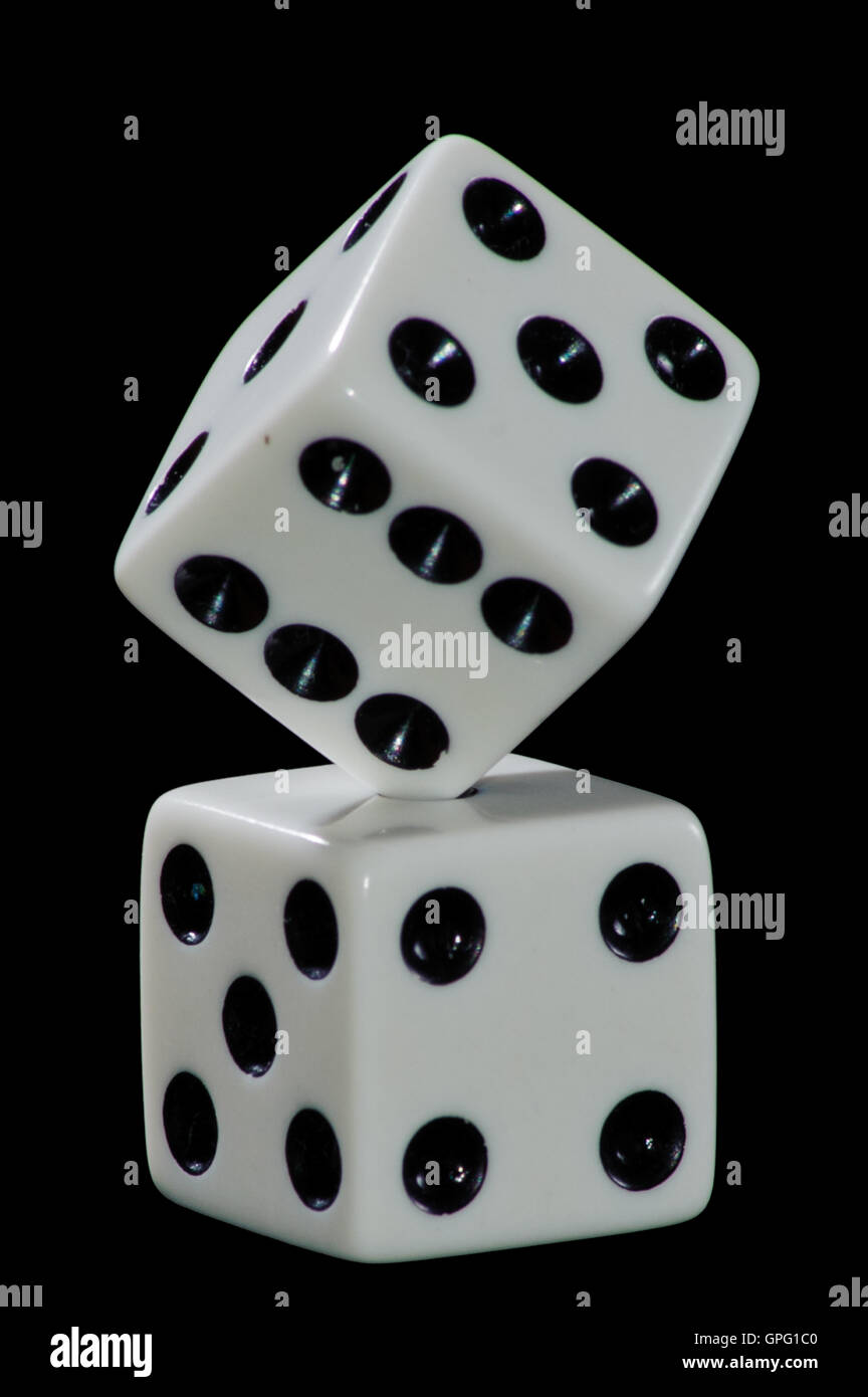 Stacked pair of dice against black background Stock Photo - Alamy