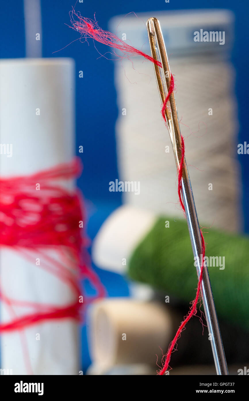 Red twisted wire to a needle Stock Photo - Alamy