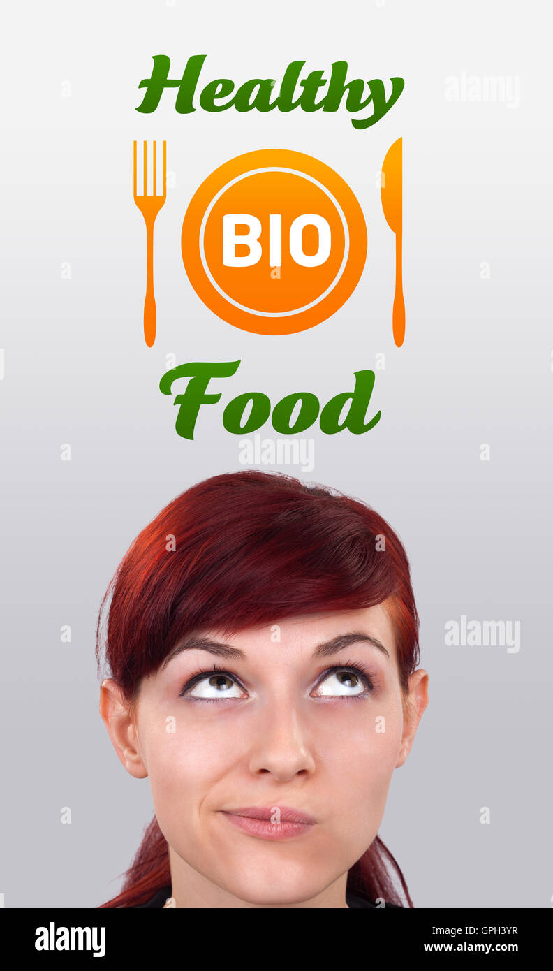 Young girl looking at healthy food sign Stock Photo - Alamy