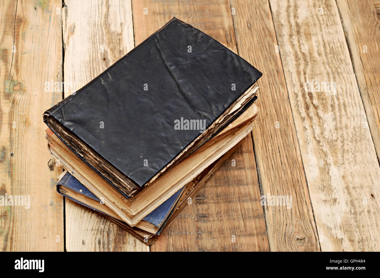Vintage old books on wooden table Stock Photo - Alamy