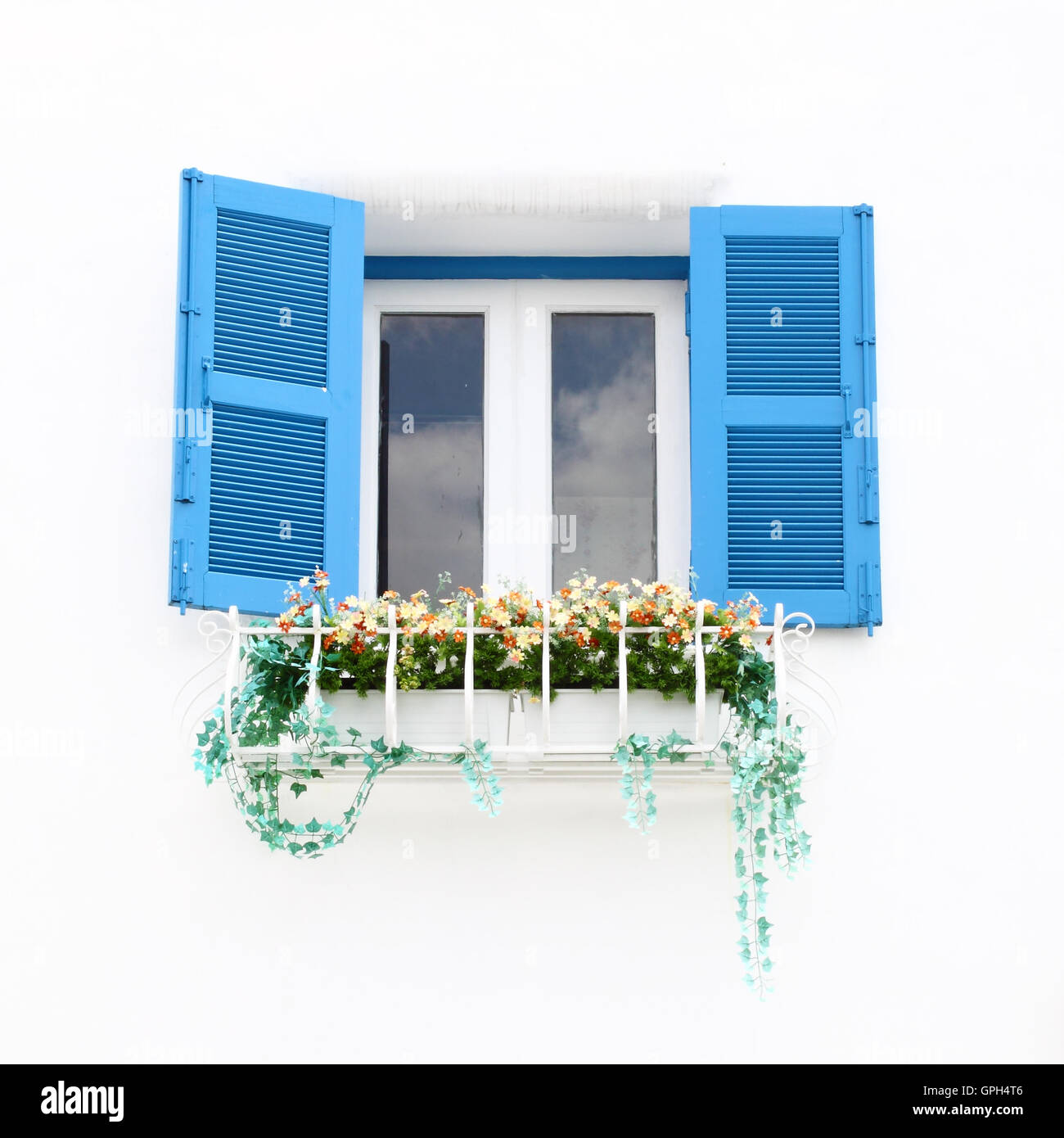 Greek Style windows and flower Stock Photo - Alamy