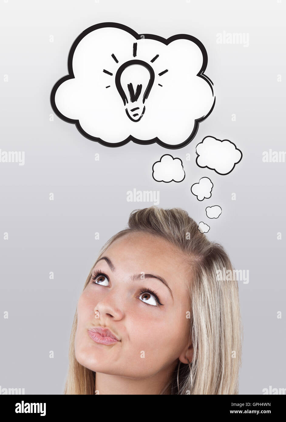 Young girl thinking with clouds Stock Photo - Alamy
