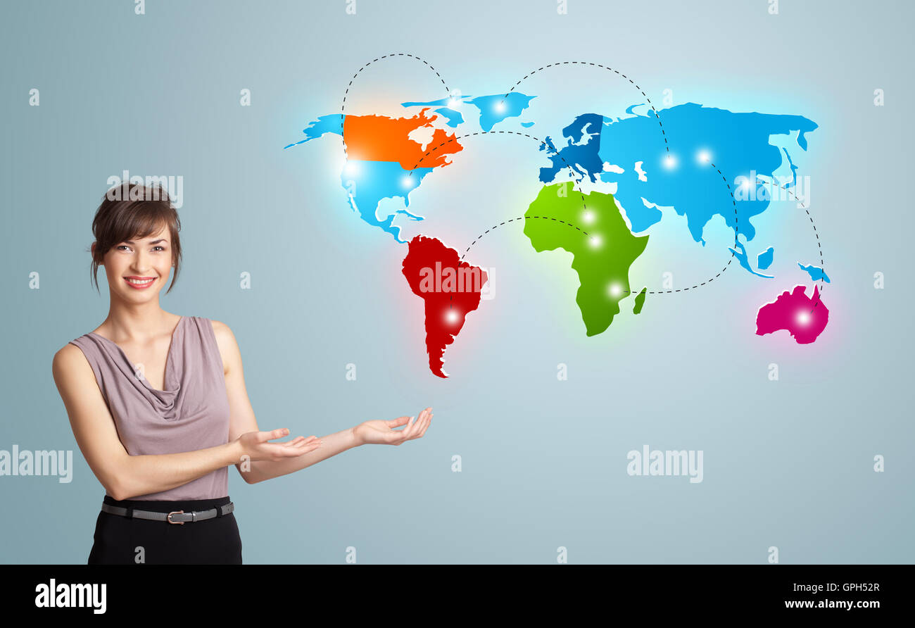 Young woman presenting colorful world map Stock Photo - Alamy