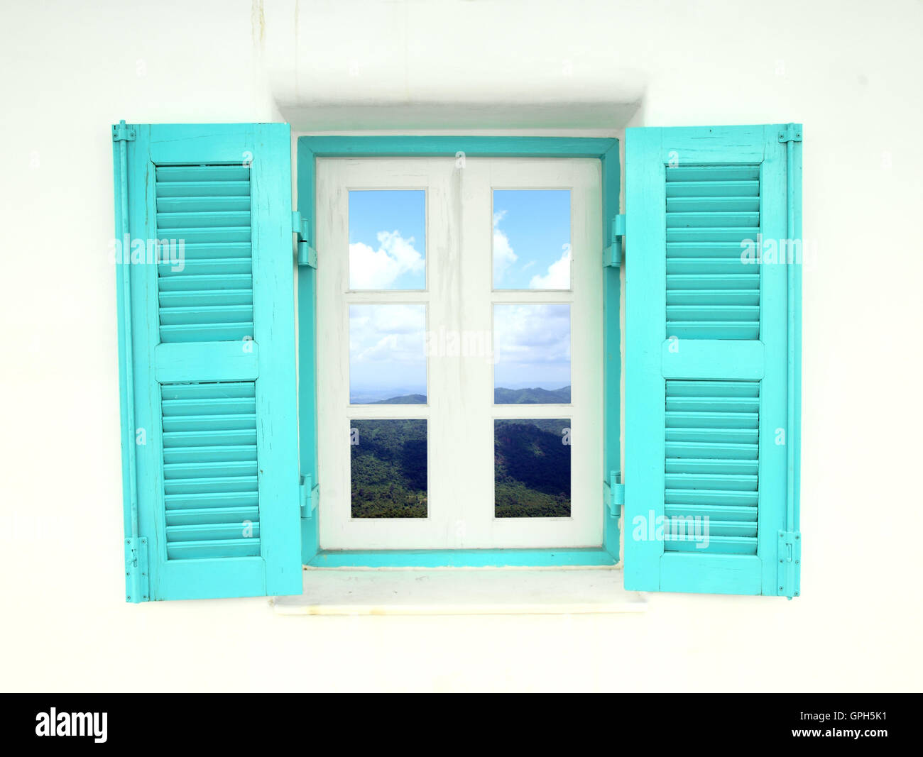 Greek style window with mountain and sky view Stock Photo - Alamy
