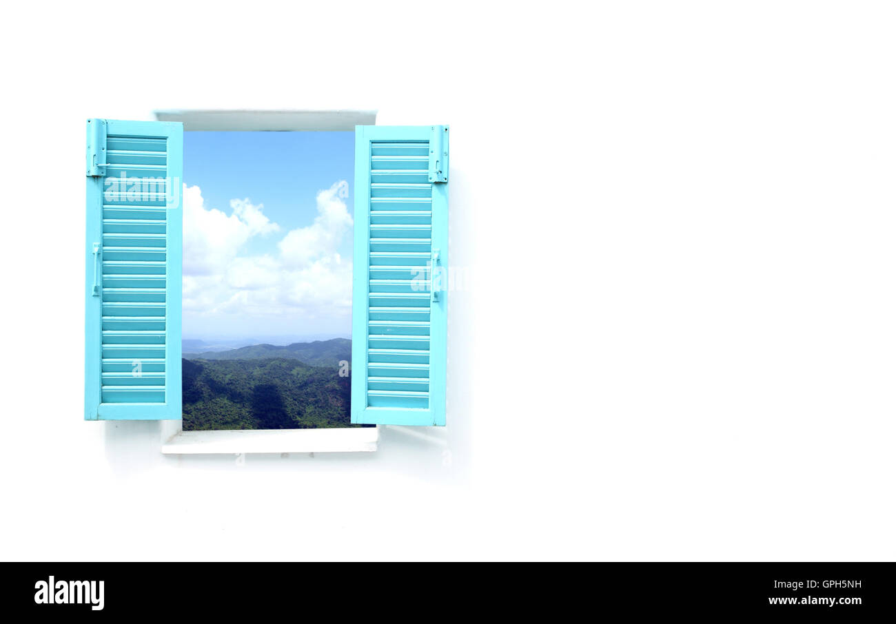 Greek style window with mountain and sky view Stock Photo - Alamy