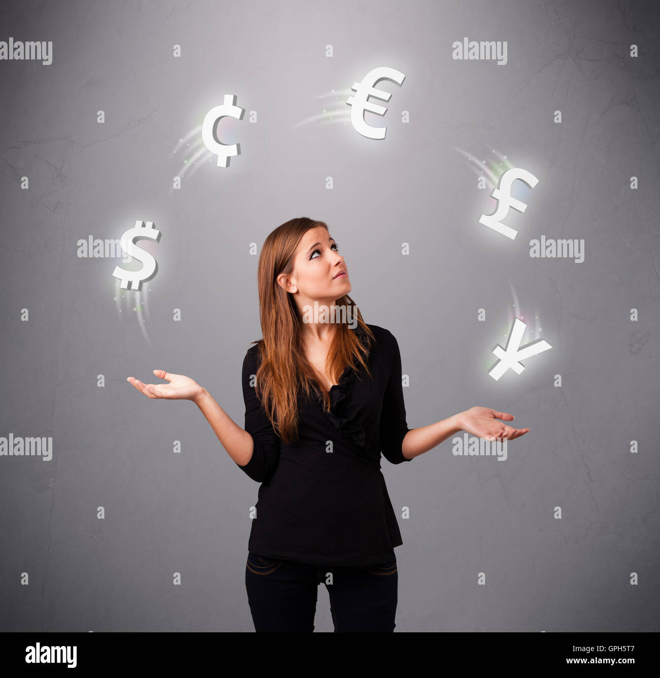 young lady standing and juggling with currency icons Stock Photo - Alamy