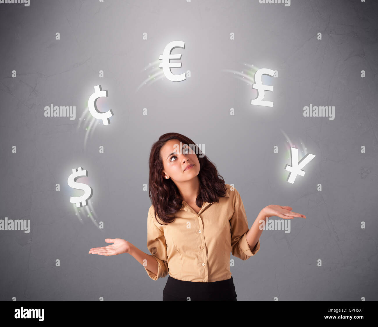 young lady standing and juggling with currency icons Stock Photo - Alamy