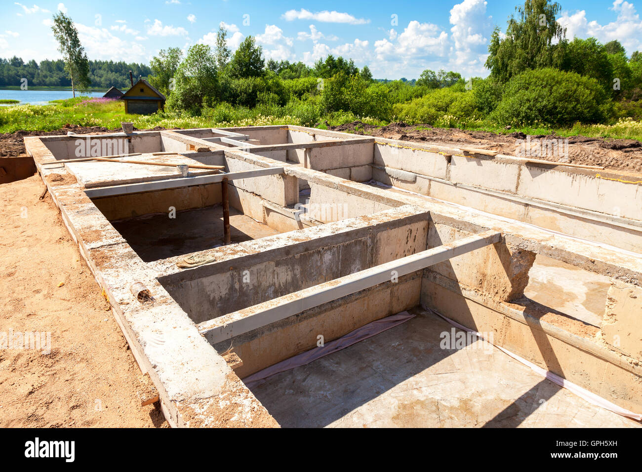View of construction site and house foundation in preparation process ...