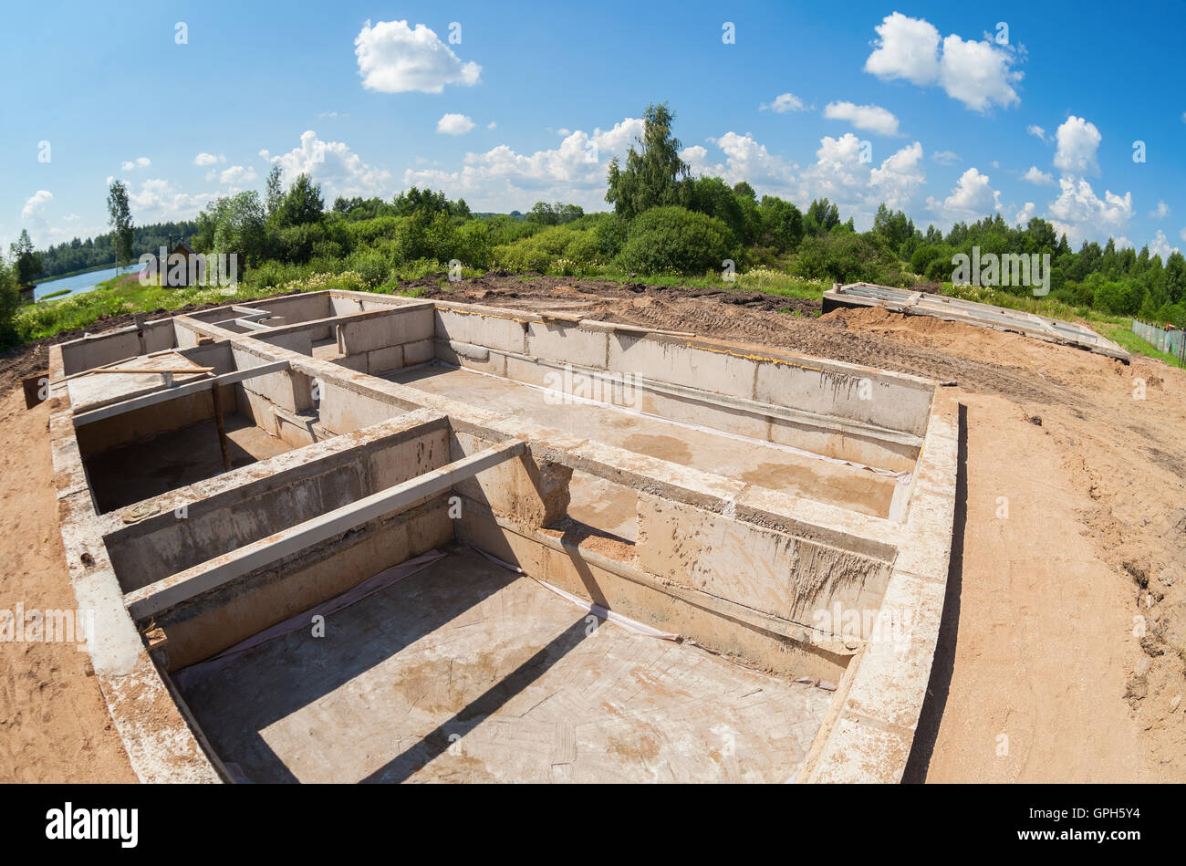 View of construction site and house foundation in preparation process ...