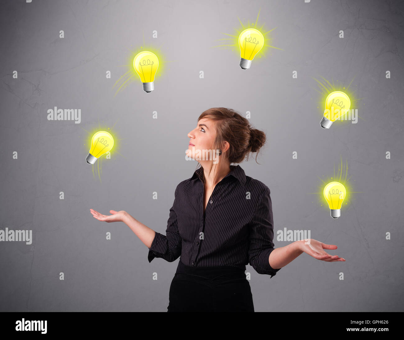 young lady standing and juggling with light bulbs Stock Photo - Alamy