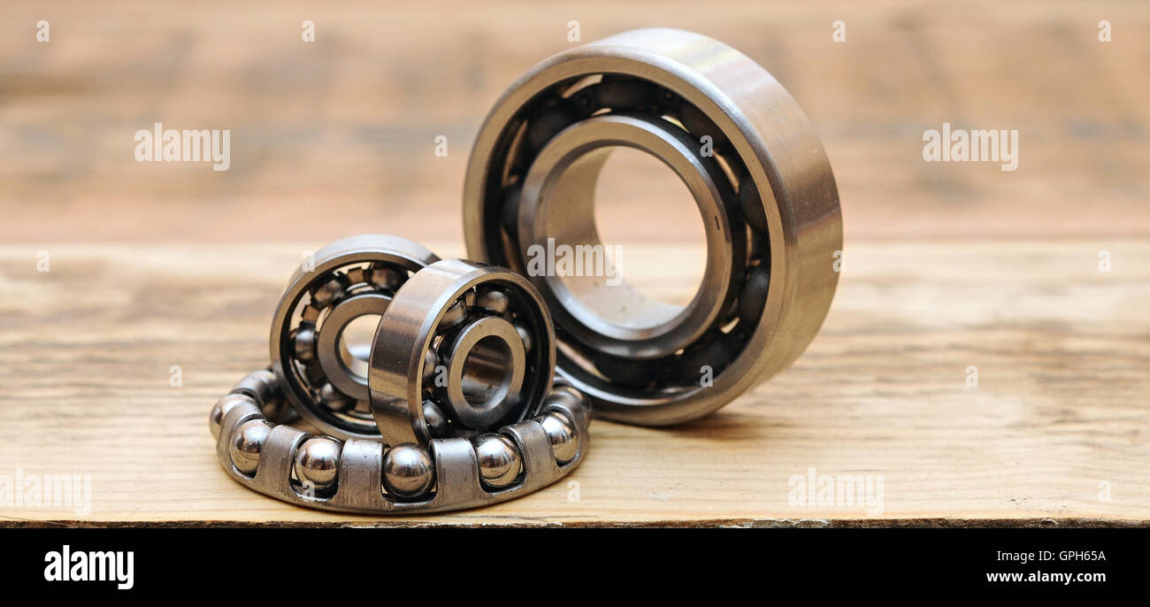 steel ball bearings on wooden table Stock Photo - Alamy