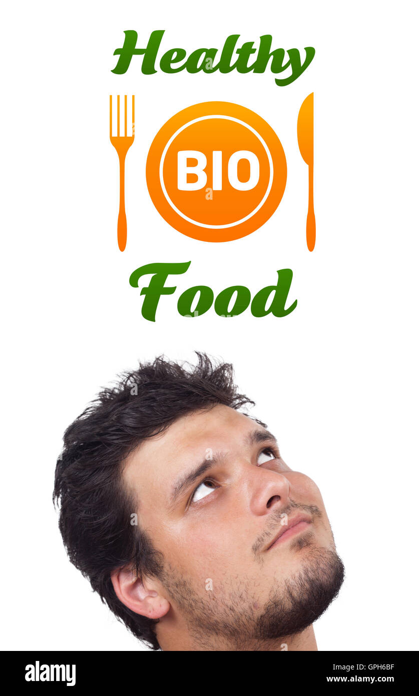 Young head looking at healthy food sign Stock Photo - Alamy