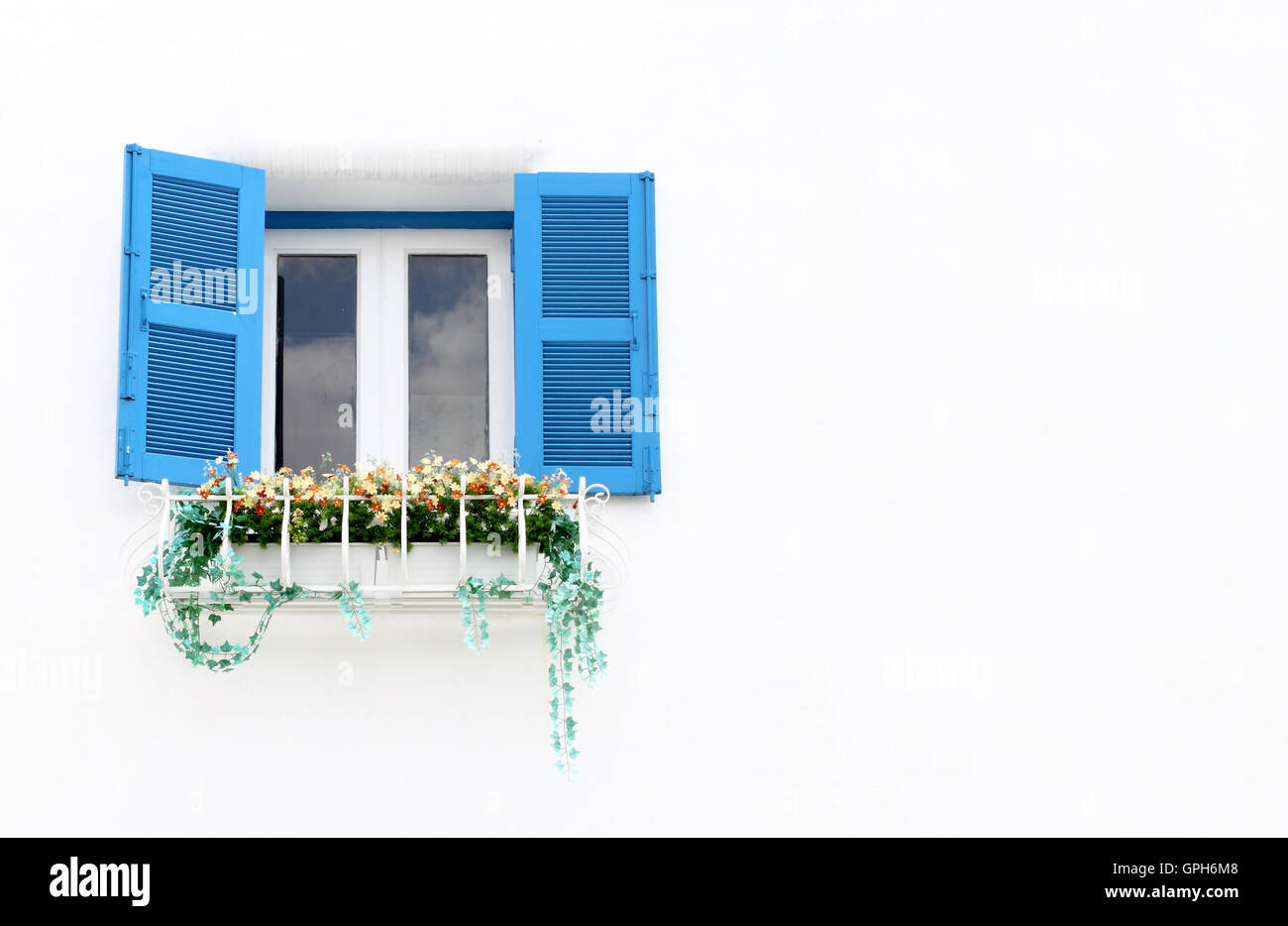Greek Style windows and flower Stock Photo - Alamy
