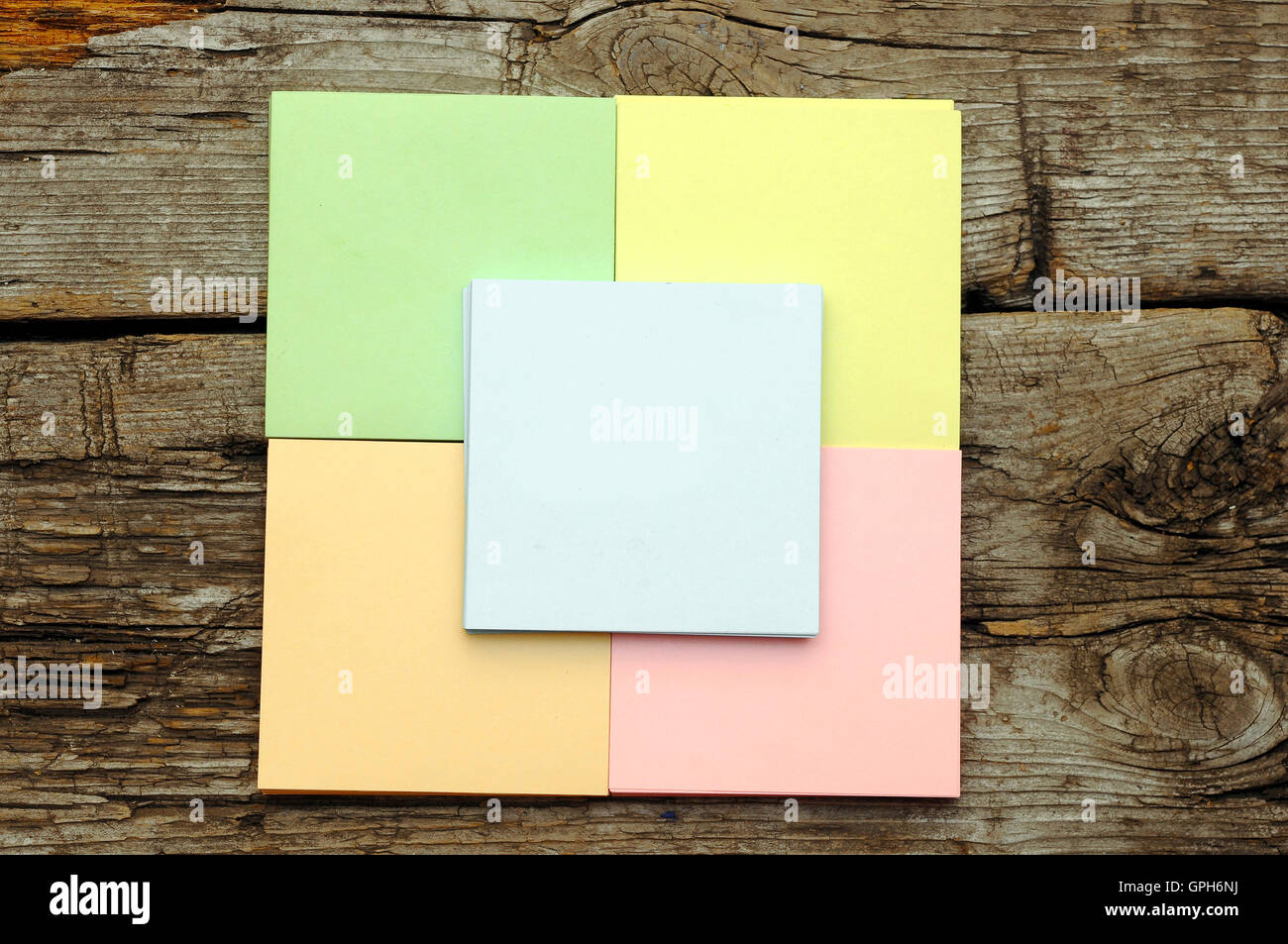 Stack of colorful sticky notes on wooden background Stock Photo - Alamy