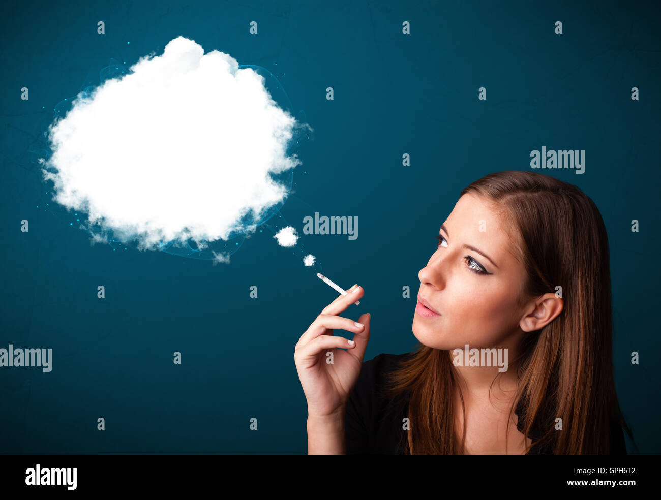Young woman smoking unhealthy cigarette with dense smoke Stock Photo ...