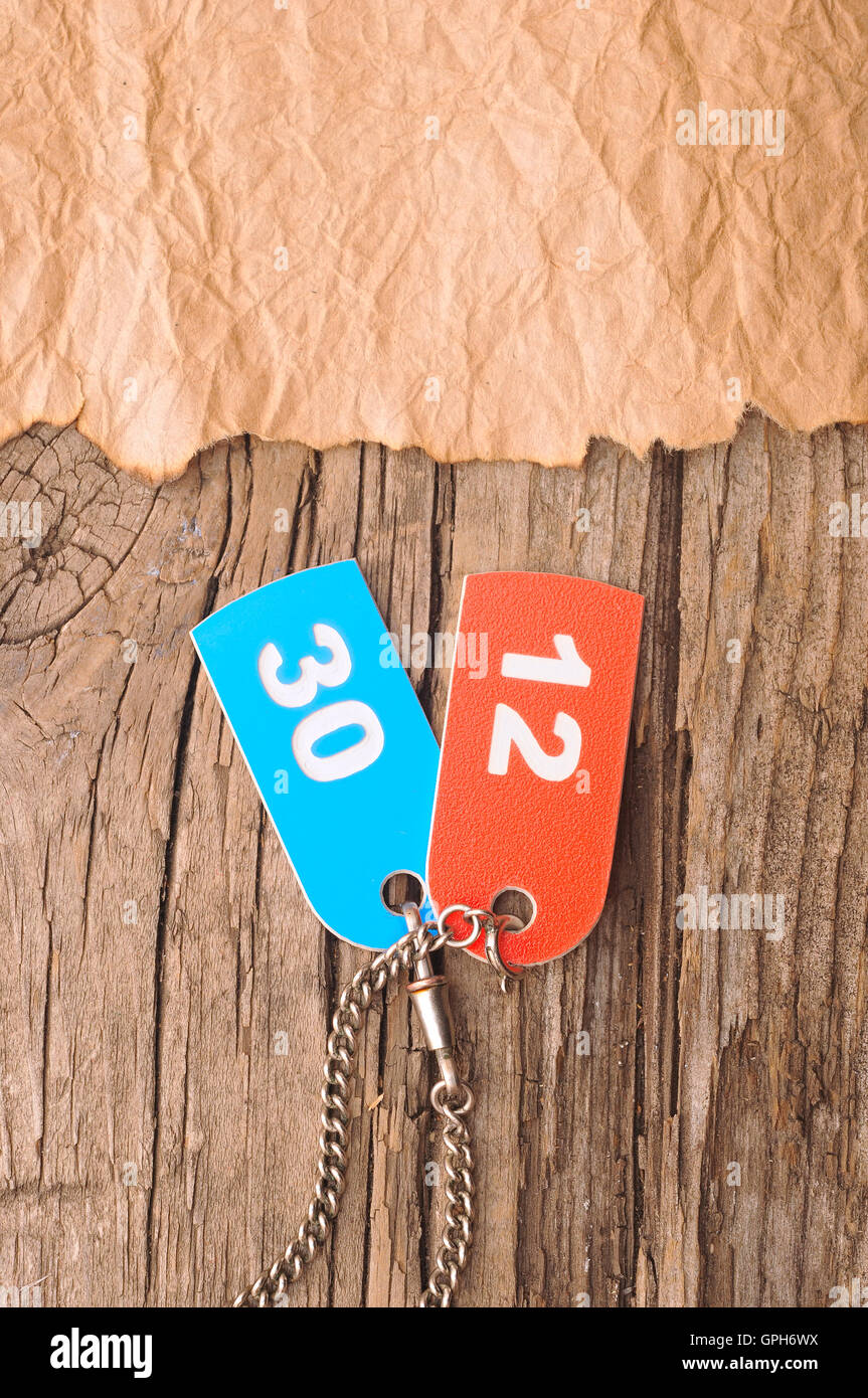 two colorful tags with numbers on old paper Stock Photo - Alamy