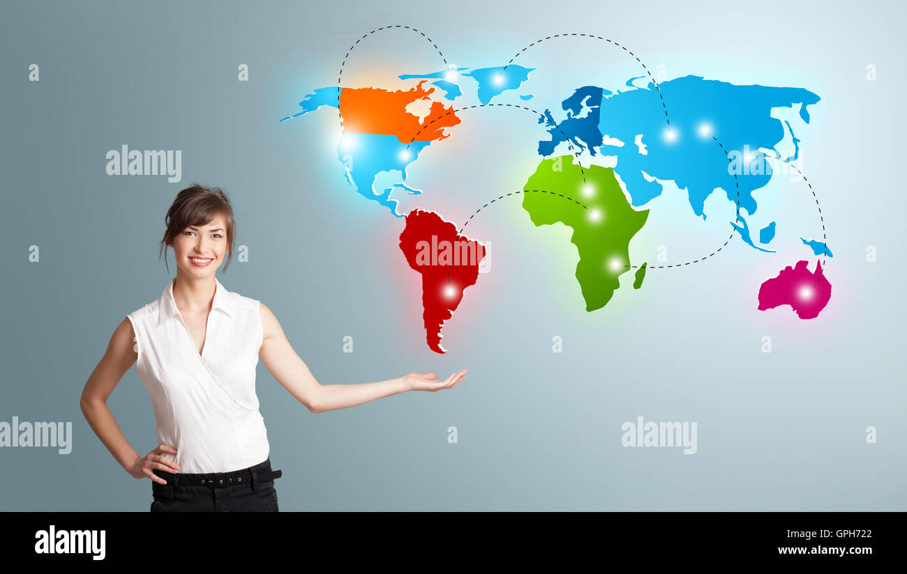 Young woman presenting colorful world map Stock Photo - Alamy