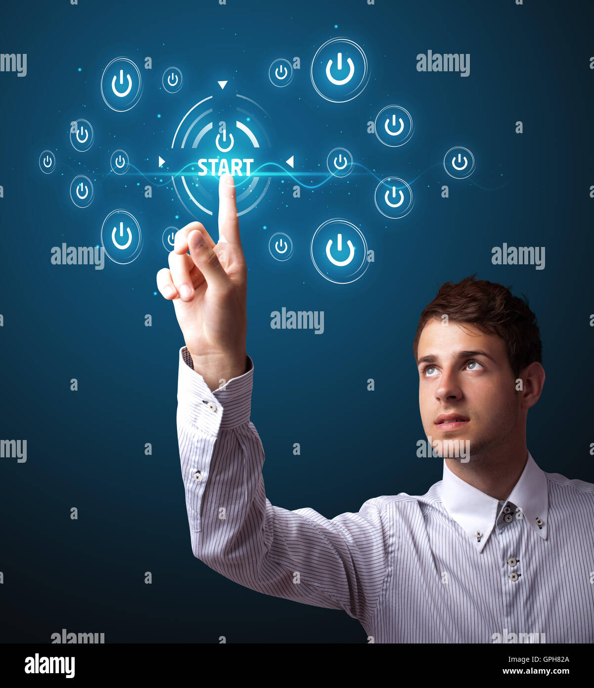 Businessman pressing simple type of start buttons Stock Photo - Alamy