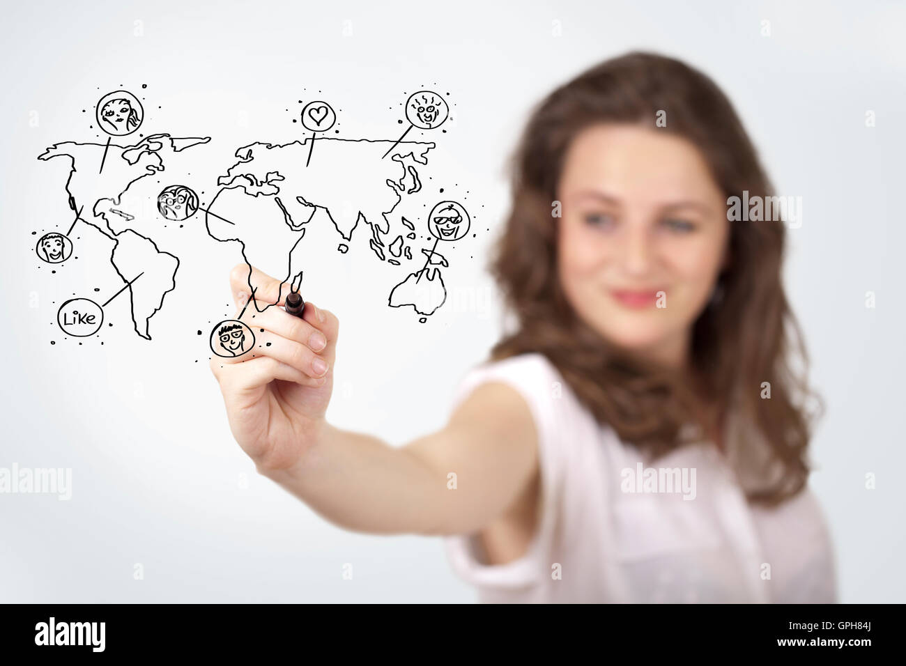 Young woman drawing a social map on whiteboard Stock Photo - Alamy