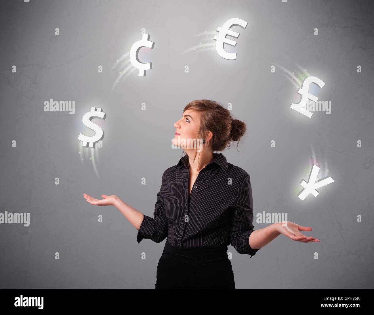 young lady standing and juggling with currency icons Stock Photo - Alamy