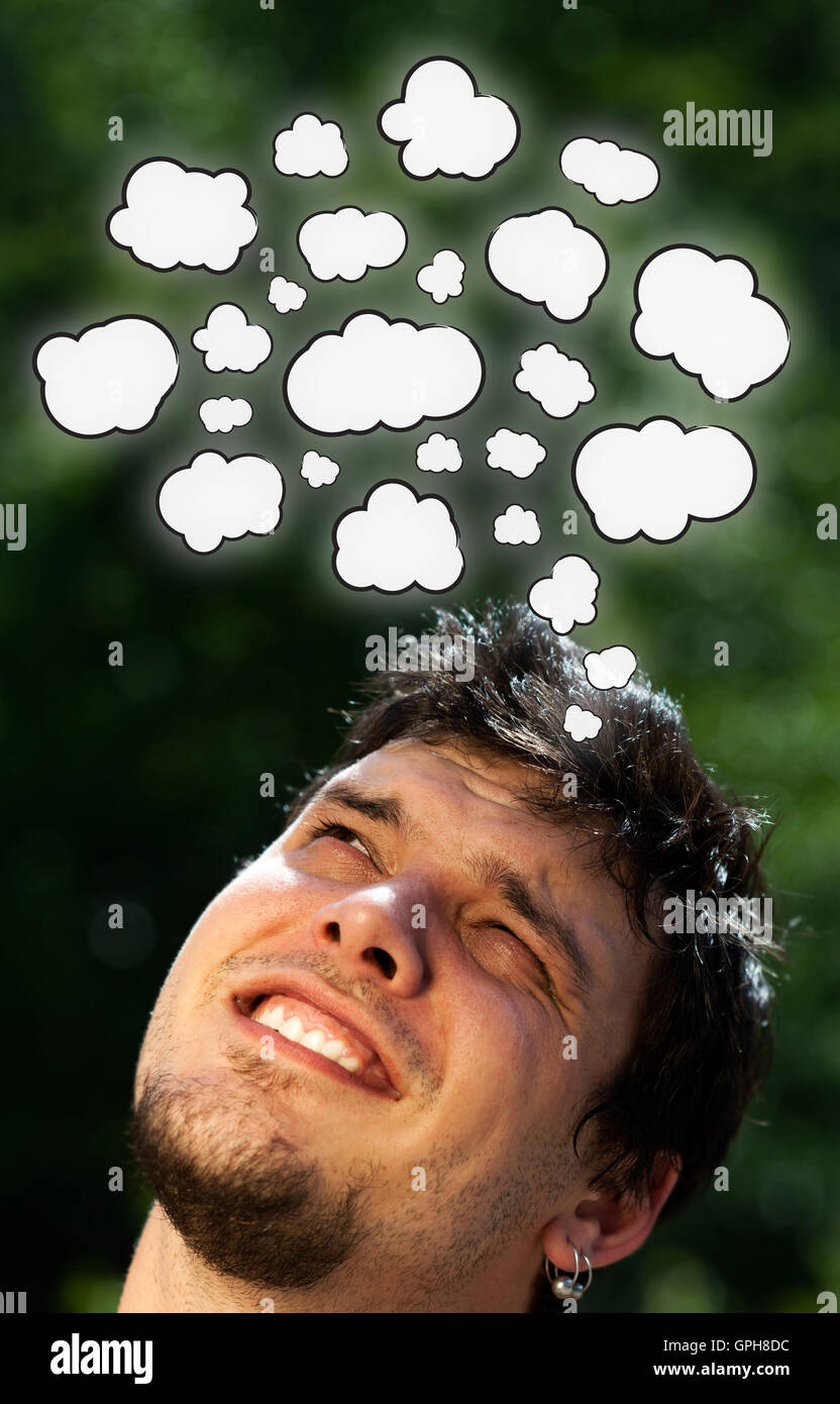 Young head thinking with clouds Stock Photo - Alamy