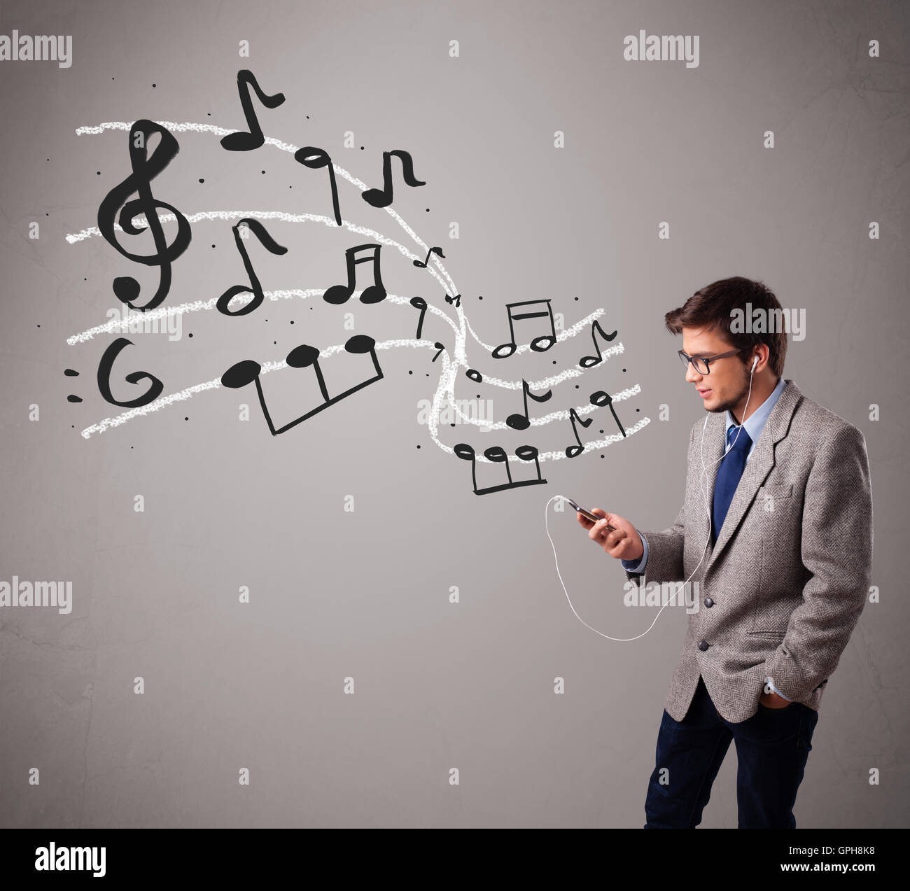 handsome boy singing and listening to music with musical notes Stock ...