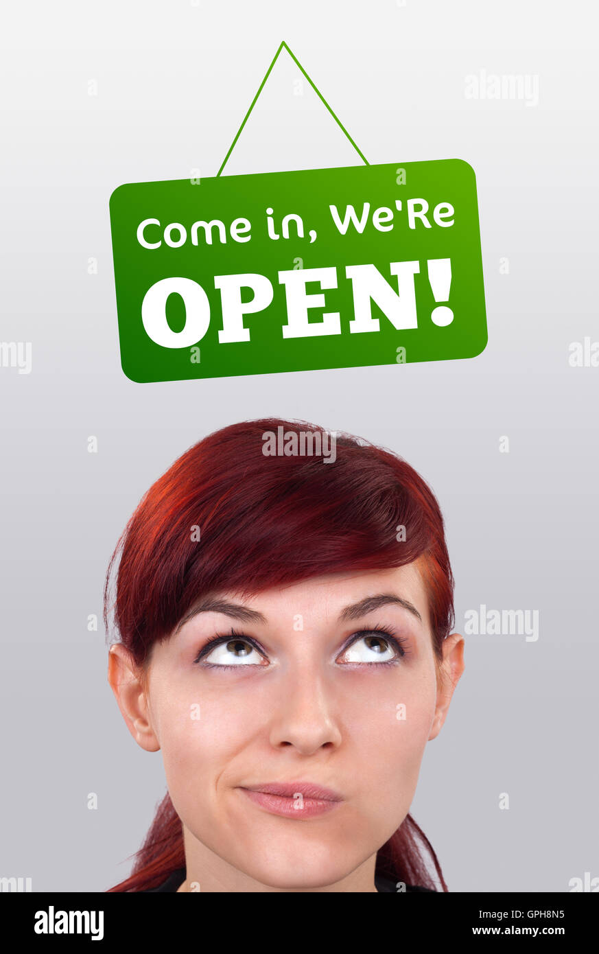 Young girl head looking at closed and open signs Stock Photo - Alamy