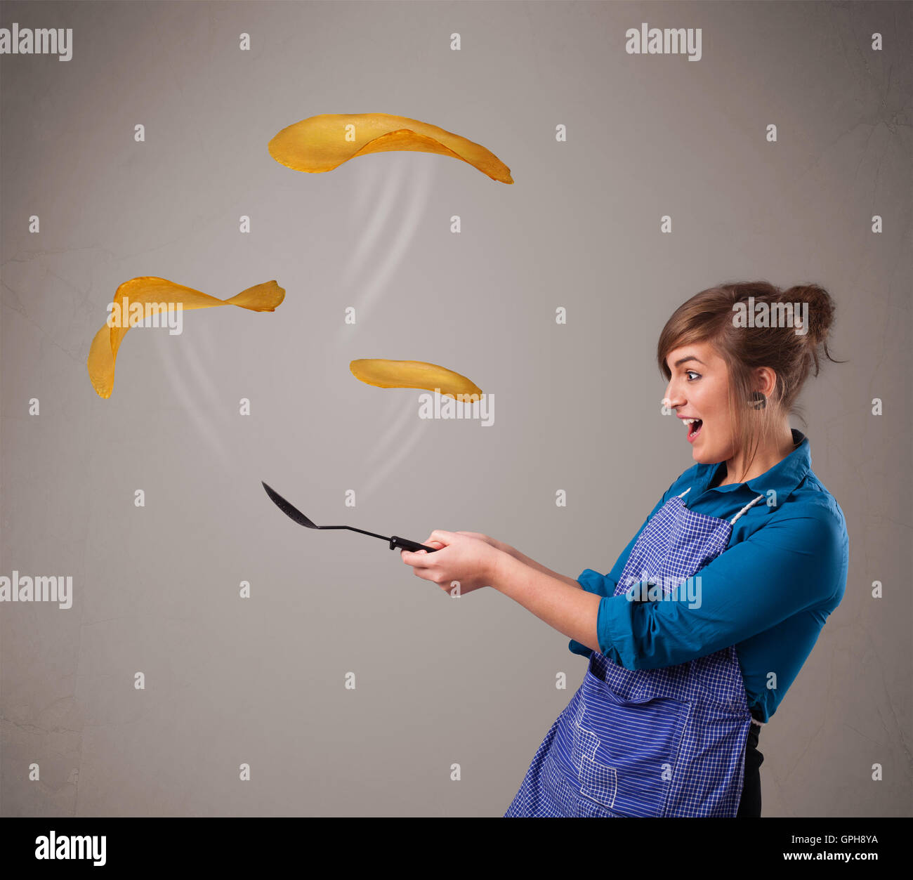 Woman making pancakes Stock Photo - Alamy