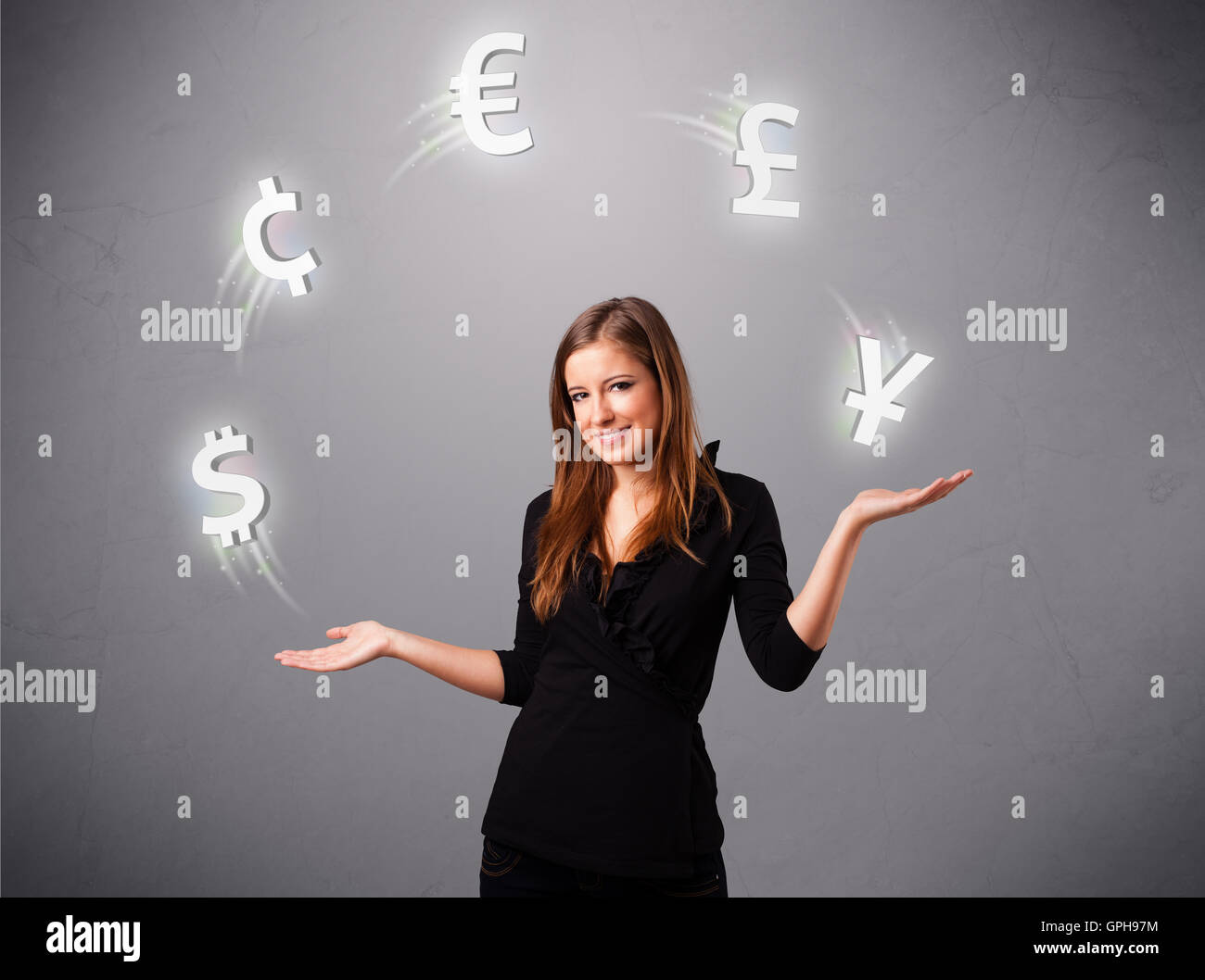 young lady standing and juggling with currency icons Stock Photo - Alamy