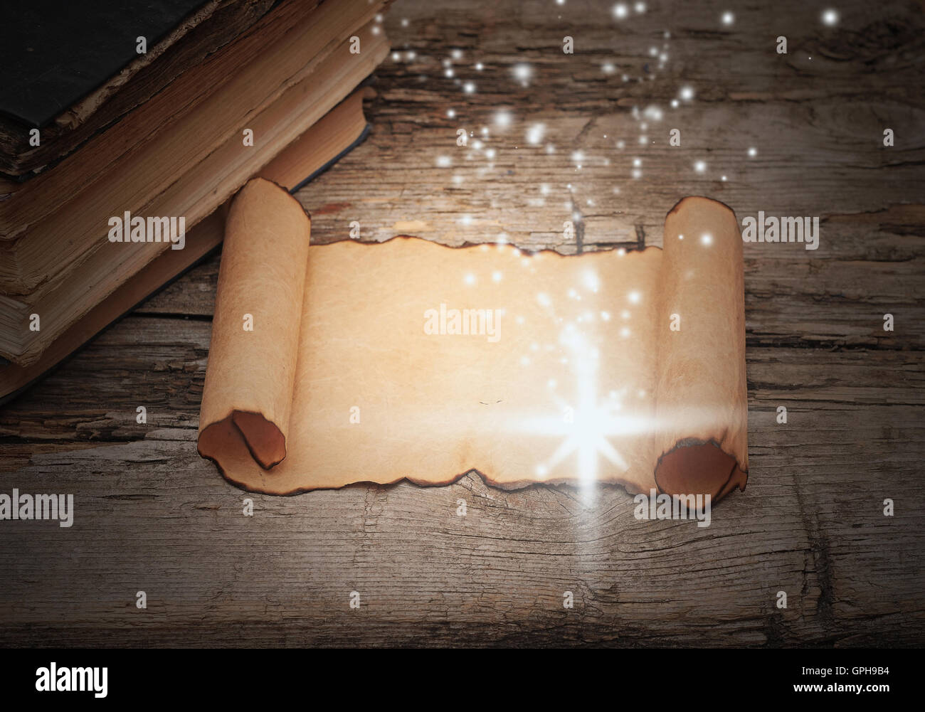 Vintage old paper scroll at wood background Stock Photo - Alamy