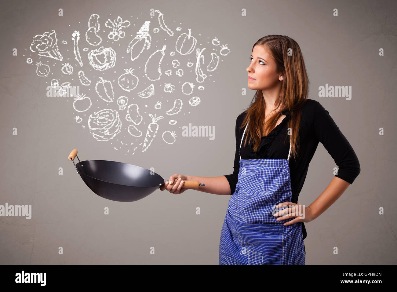 Woman cooking vegetables Stock Photo - Alamy