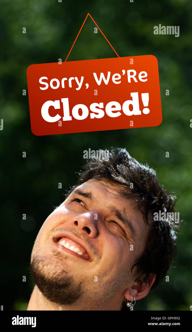 Young persons head looking at closed and open signs Stock Photo - Alamy