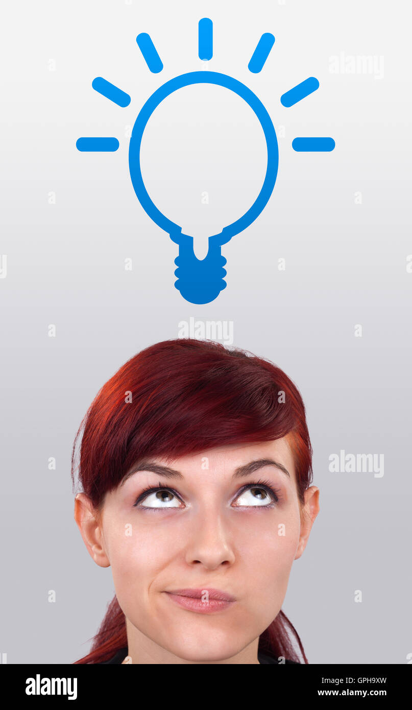 Young girl looking at idea type of sign Stock Photo - Alamy