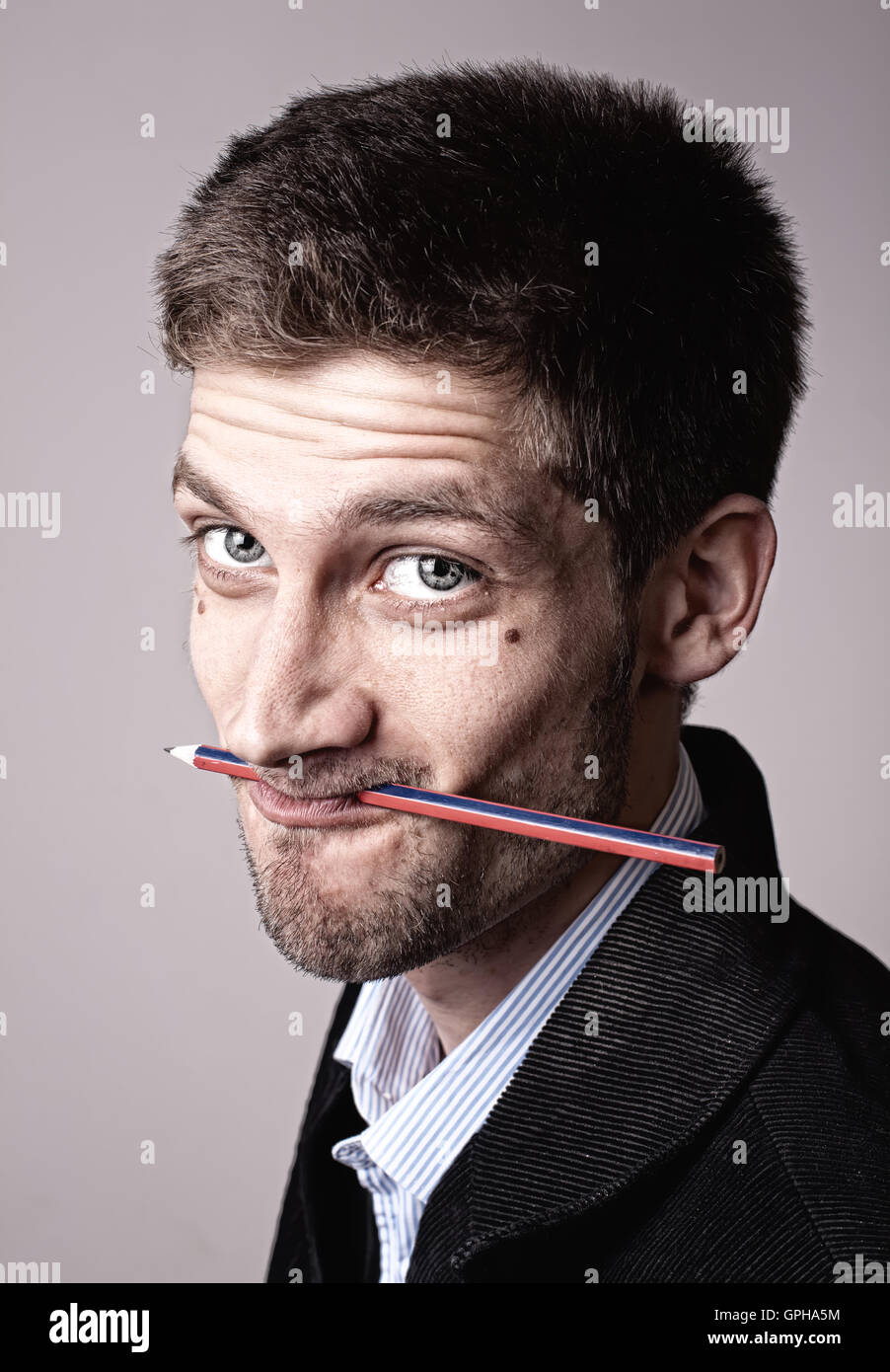 young man with pencil Stock Photo - Alamy