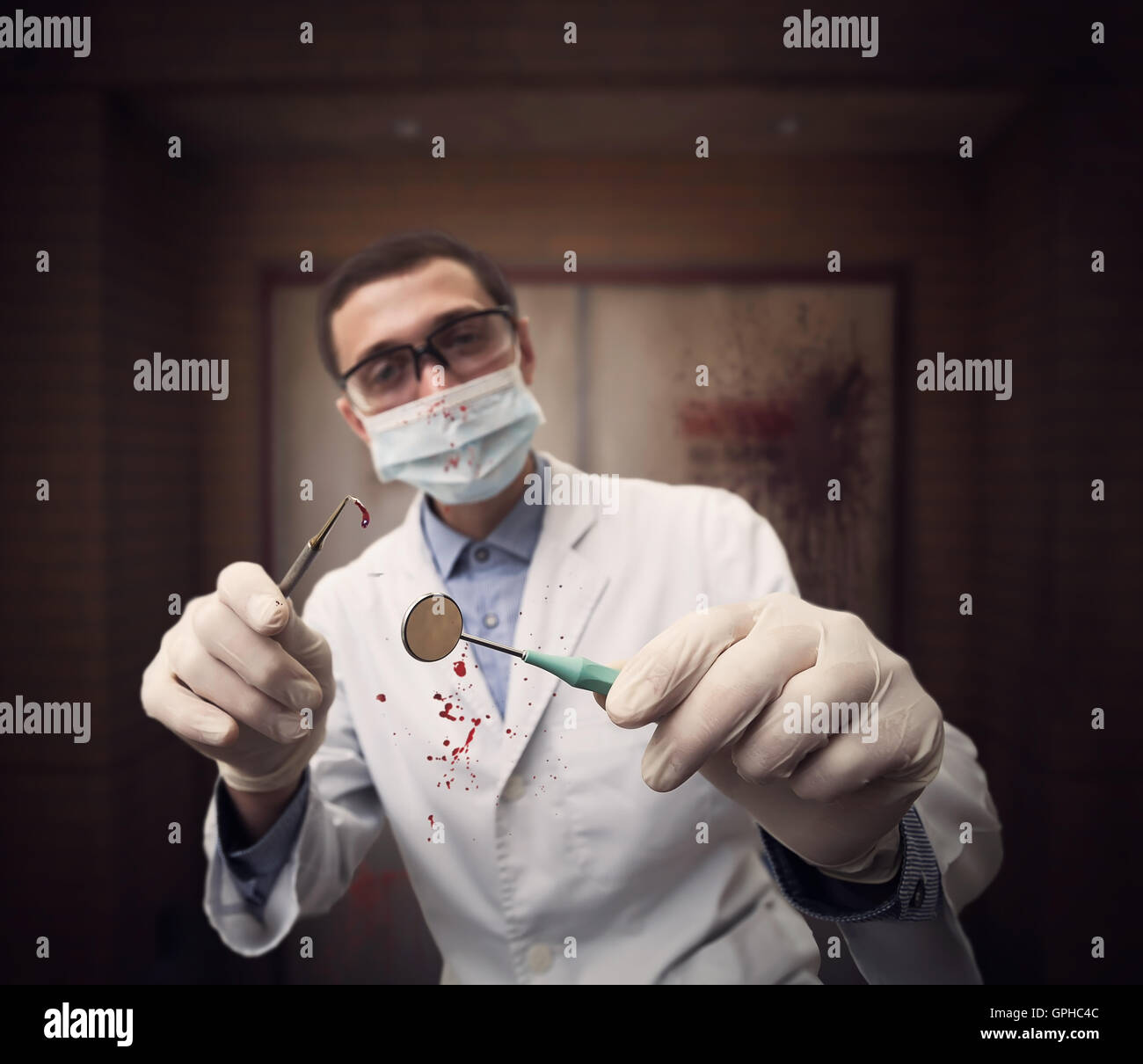 Scary mad dentist Stock Photo - Alamy