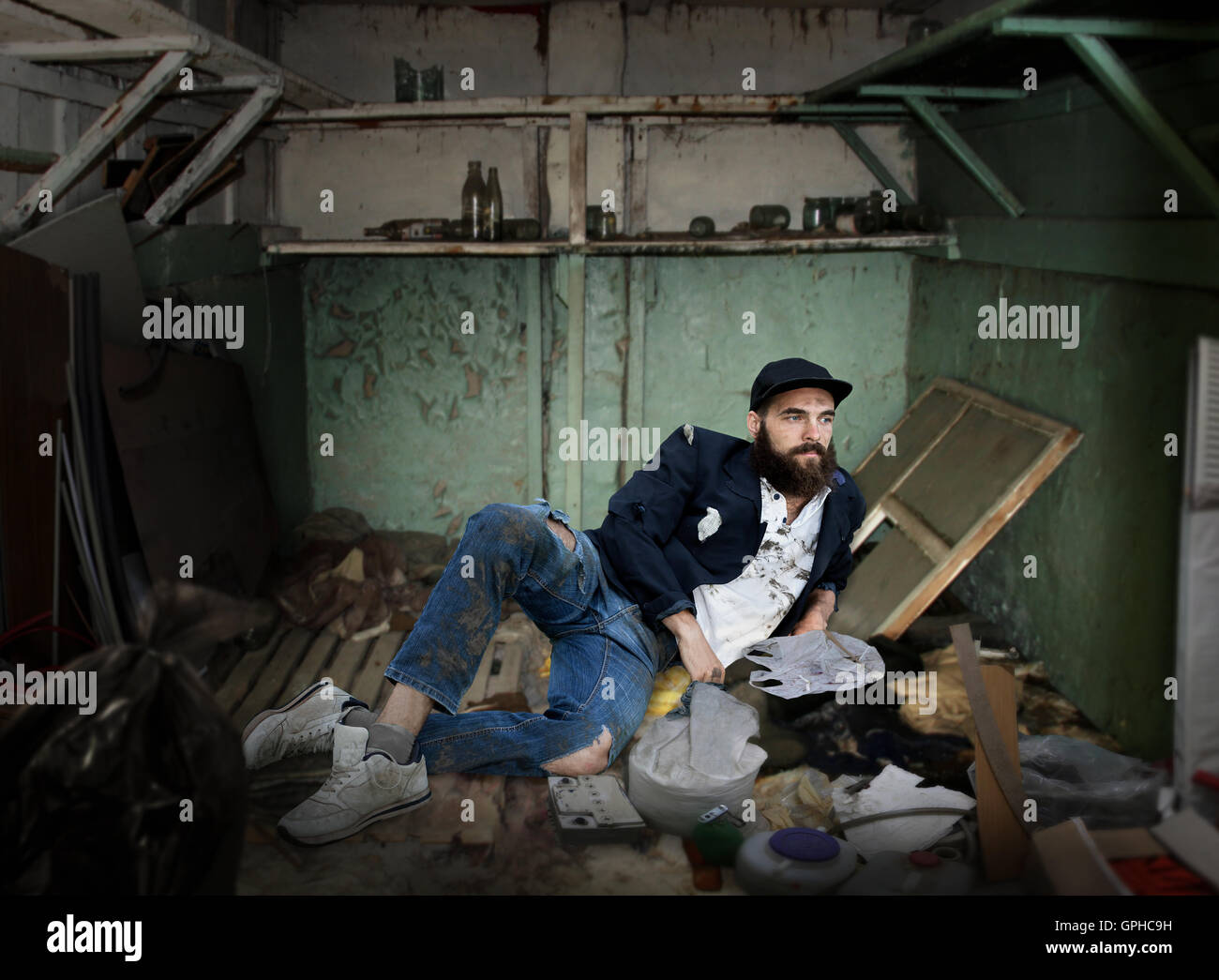 Vagrant in a dirty room Stock Photo - Alamy