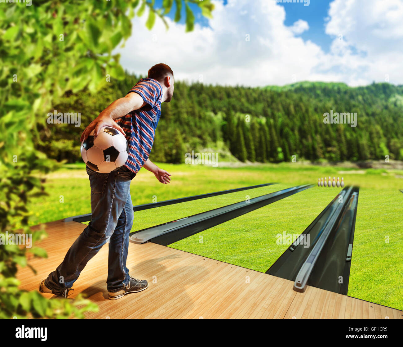 Man playing bowling Stock Photo - Alamy