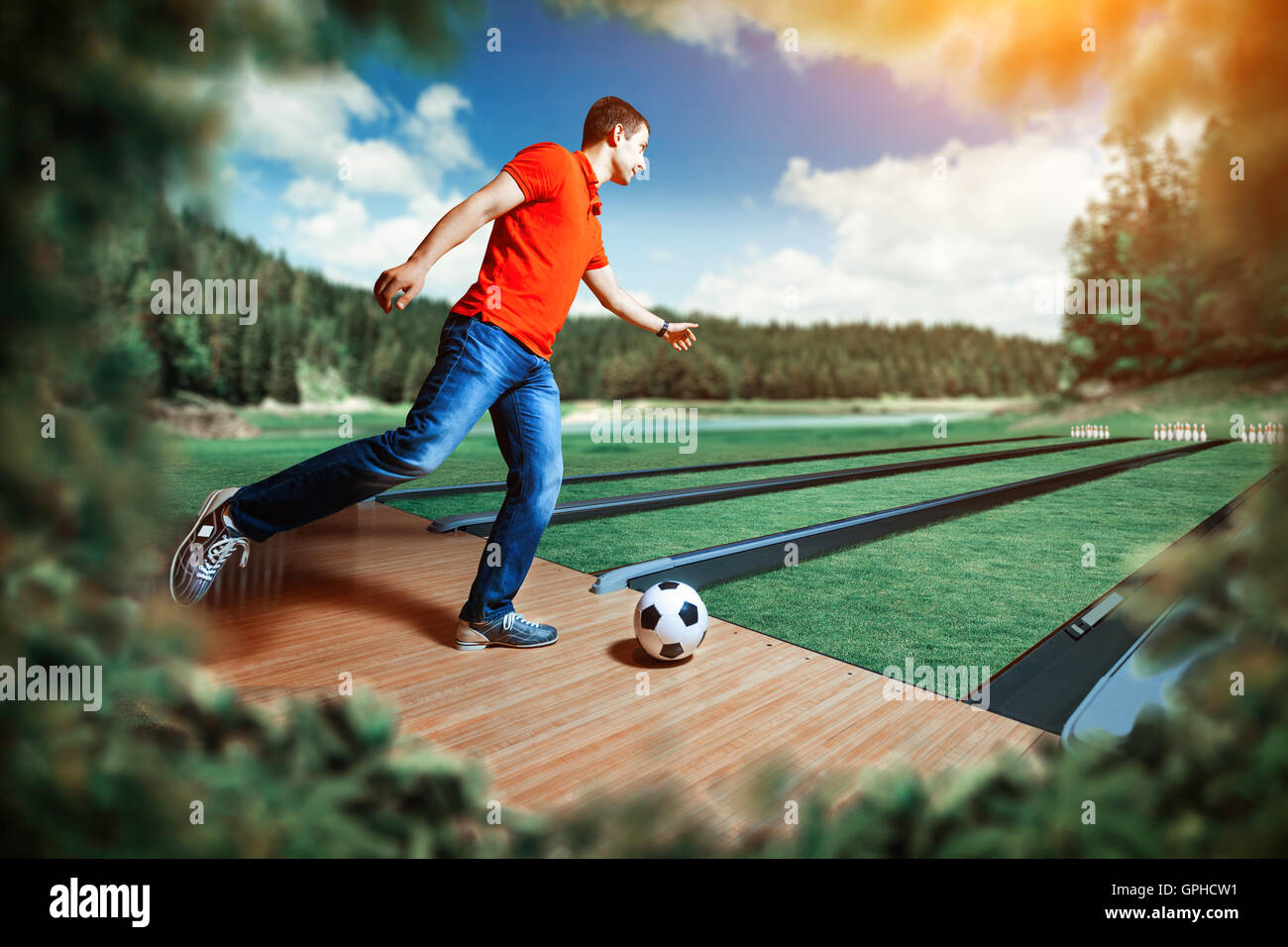 Man playing football Stock Photo - Alamy