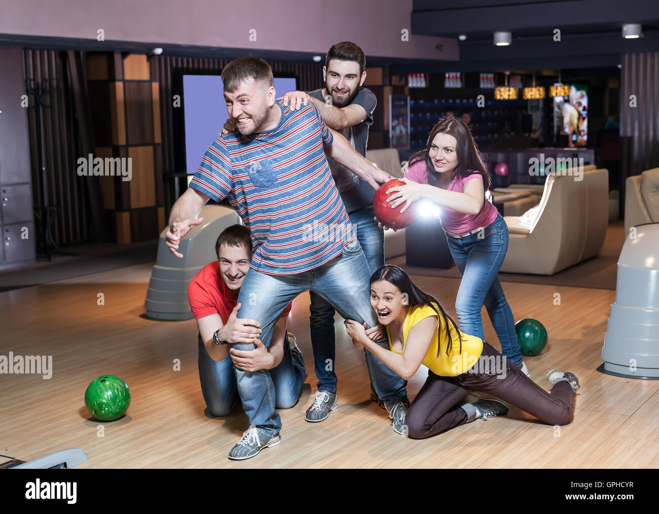 Friends having fun in bowling Stock Photo - Alamy