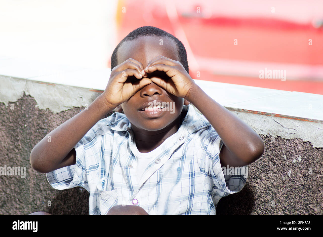 child places his hands over his eyes as a binocular vision Stock Photo ...