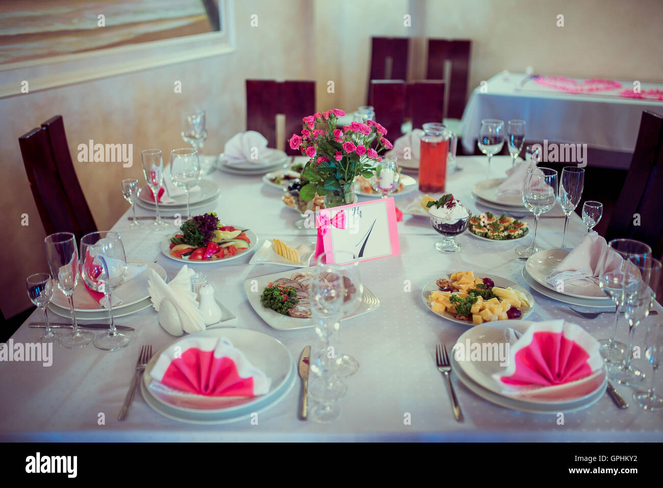 Good served table with food and drink in a restaurant Stock Photo - Alamy
