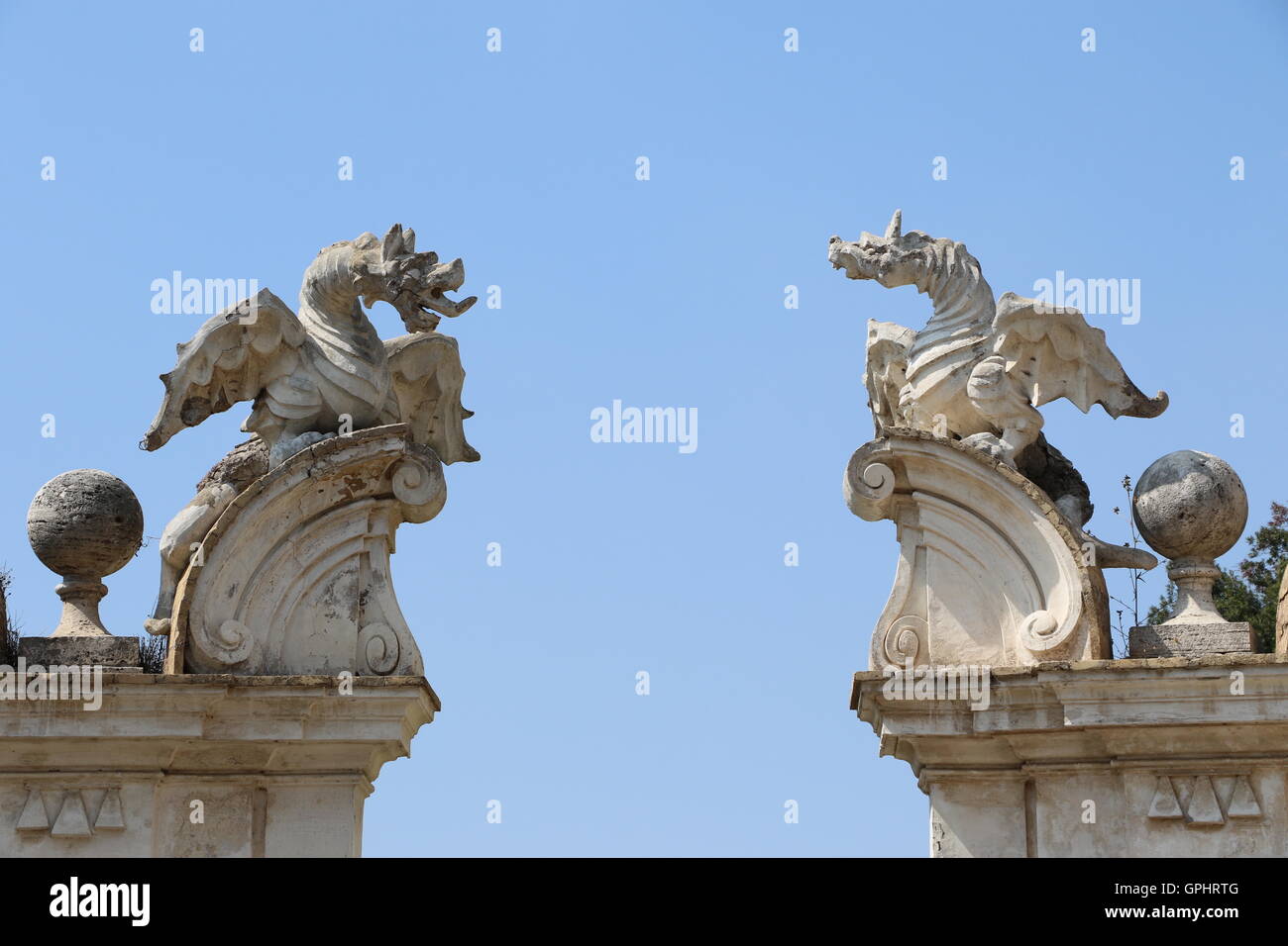 Statues of dragons of the villa Borghese in Rome Stock Photo - Alamy