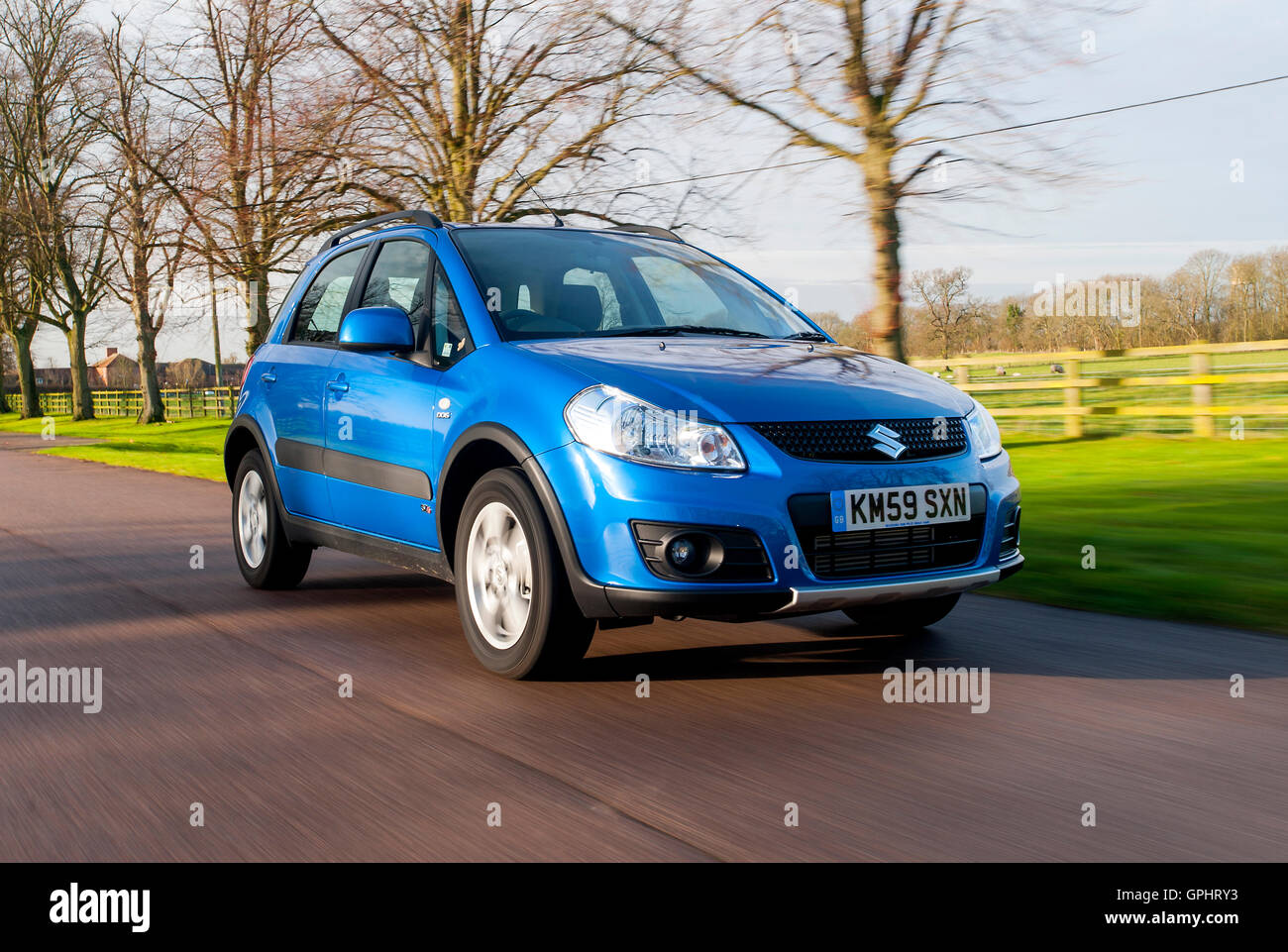 2009 Suzuki SX4 compact 4x4 SUV driving Stock Photo - Alamy