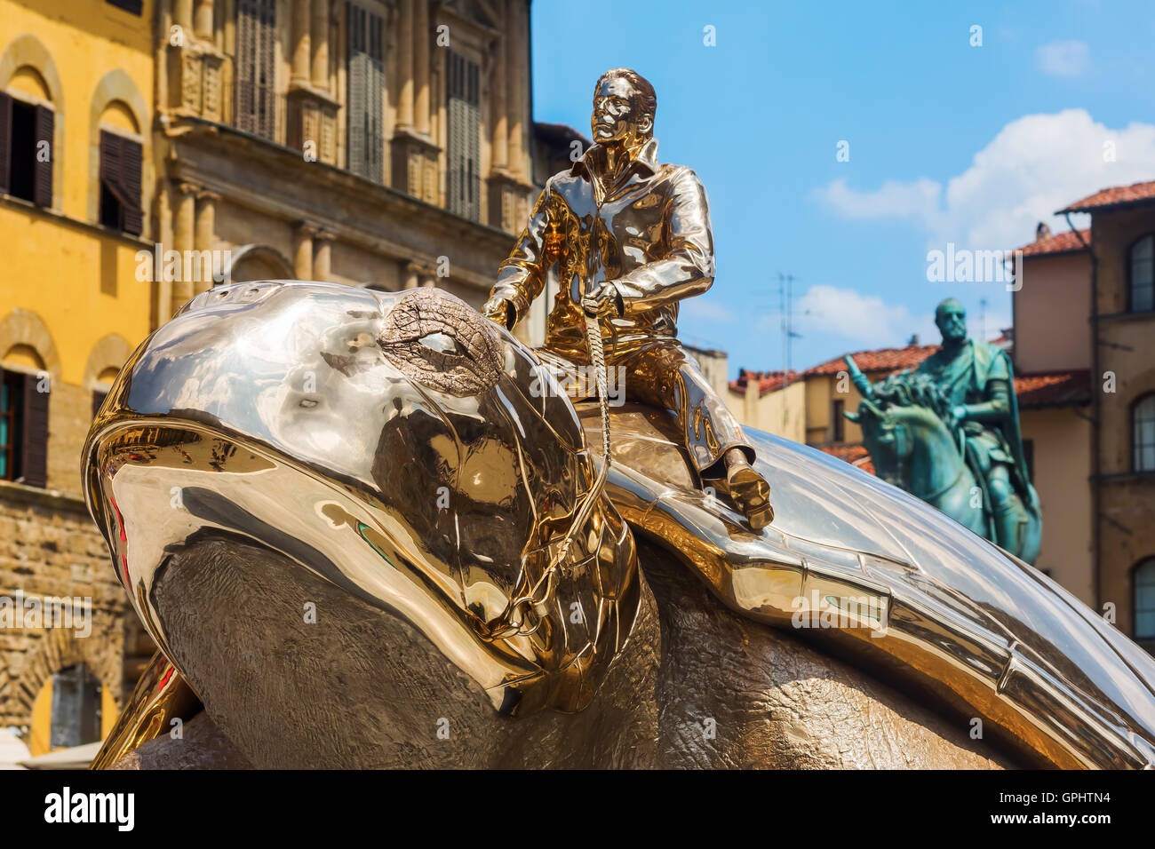 golden sculpture on the Piazza della Signoria in Florence from artist ...