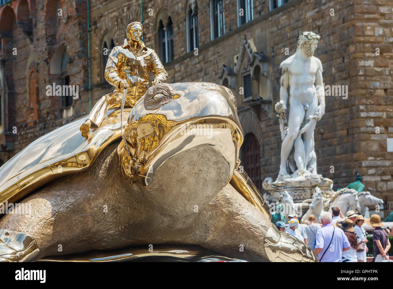 golden sculpture on the Piazza della Signoria in Florence from artist ...