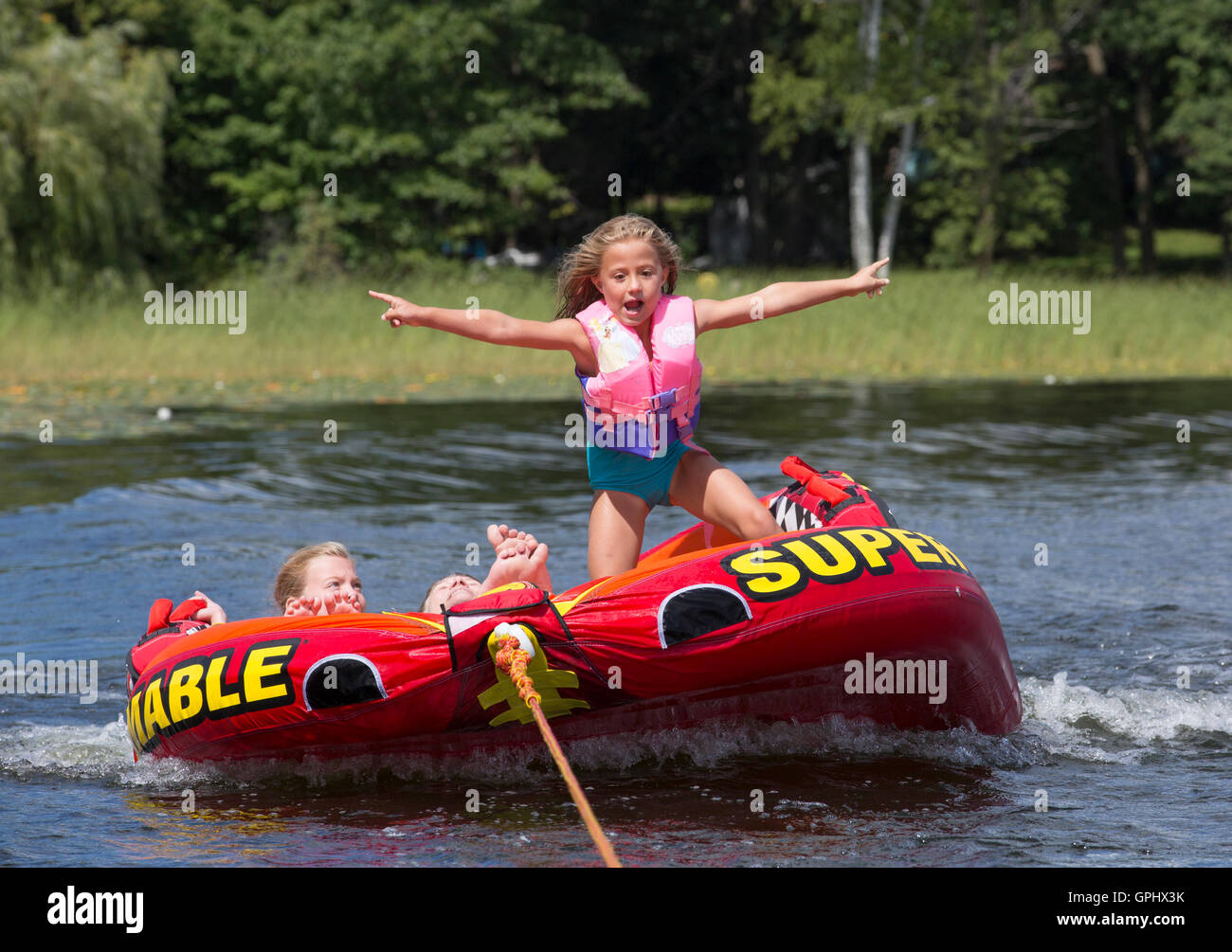 Girl on inflatable boat hi-res stock photography and images - Alamy